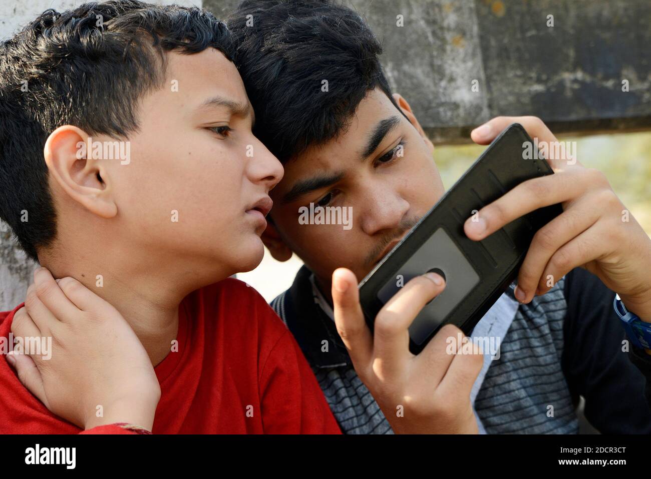 Children using smart phone Stock Photo - Alamy