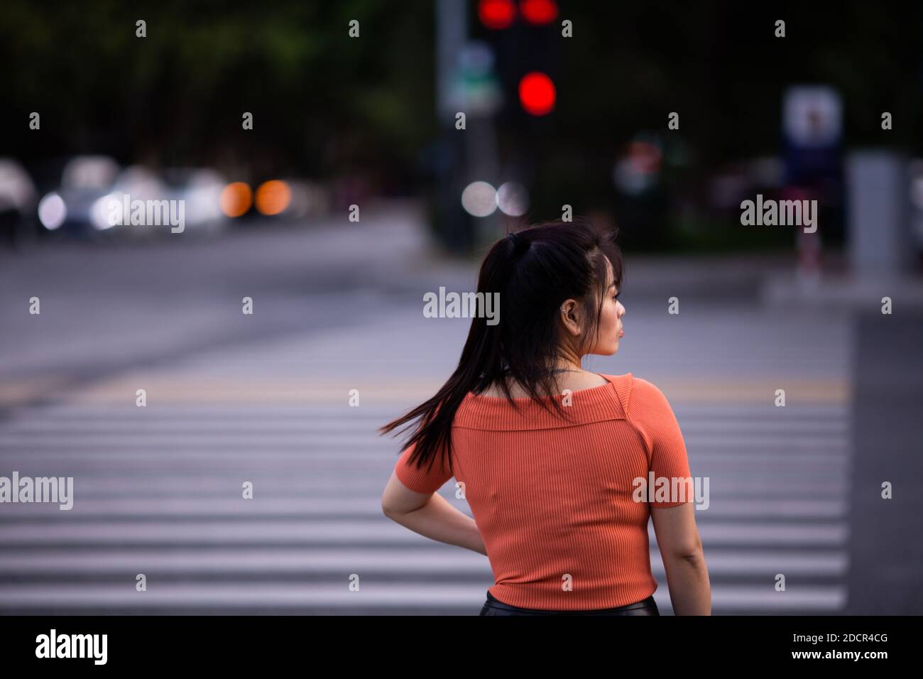 Asian woman walking behind street hi-res stock photography and images ...