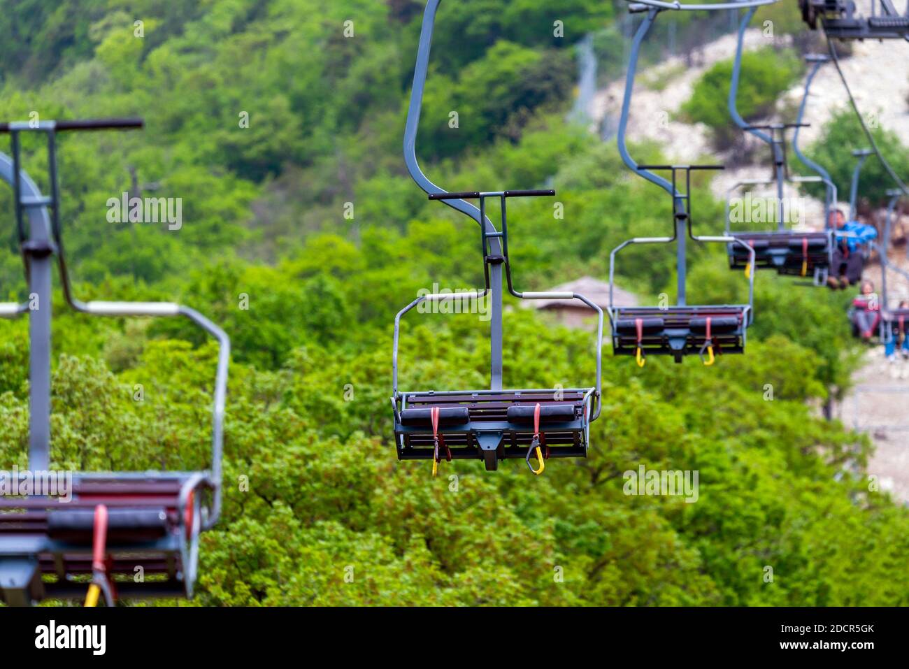 Funicular with seats in the mountains resort Stock Photo - Alamy