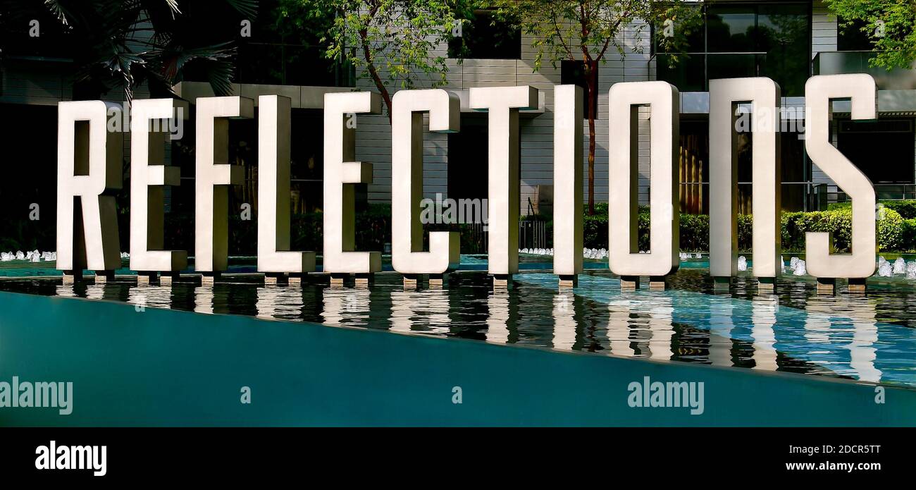 A REFLECTIONS sign in a pool Stock Photo - Alamy