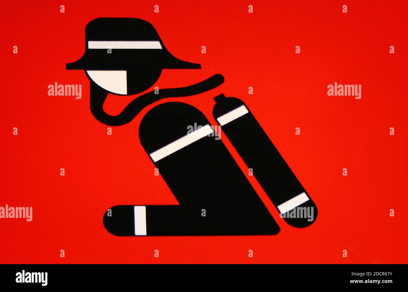 The fireman sign on red background Stock Photo - Alamy