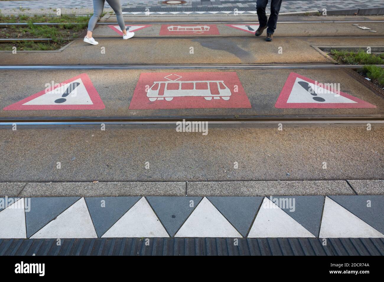 Pedestrians crossing a tramway line in Dusseldorf Stock Photo - Alamy