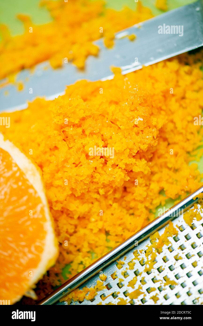 Closeup of grated fresh orange zest, food background Stock Photo - Alamy