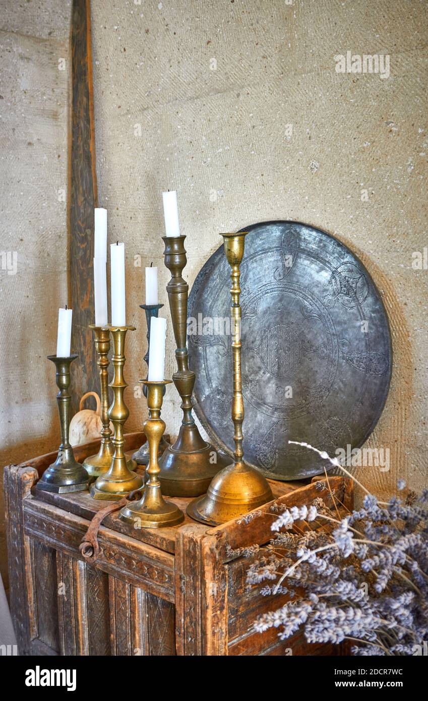 Vintage candles and candle holders onto antique furniture Stock Photo ...