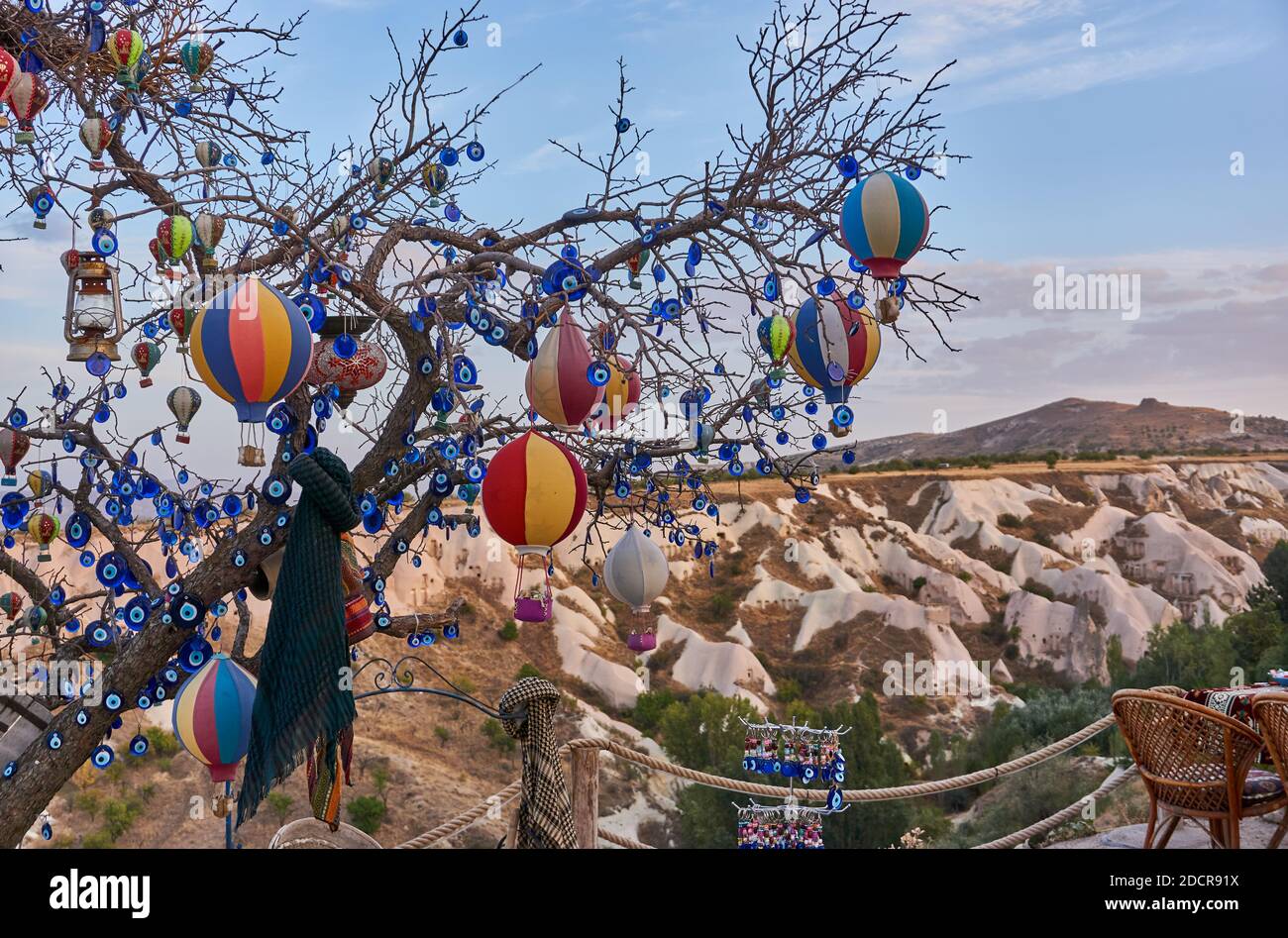Evil eye charms hanging on a tree Stock Photo - Alamy