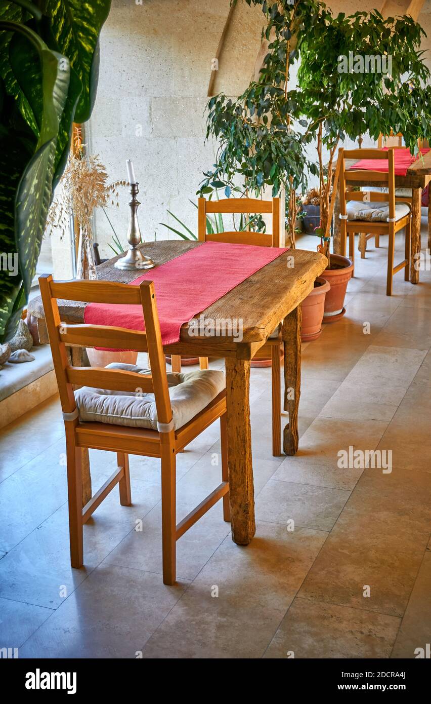 Beautiful interior decoration with wooden tables and chairs Stock Photo ...