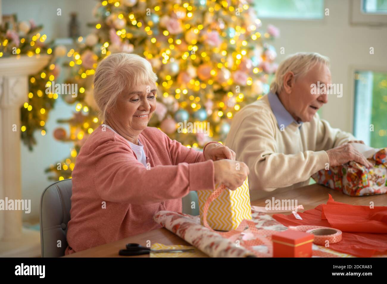 Couple enjoying packing present hi-res stock photography and images - Alamy