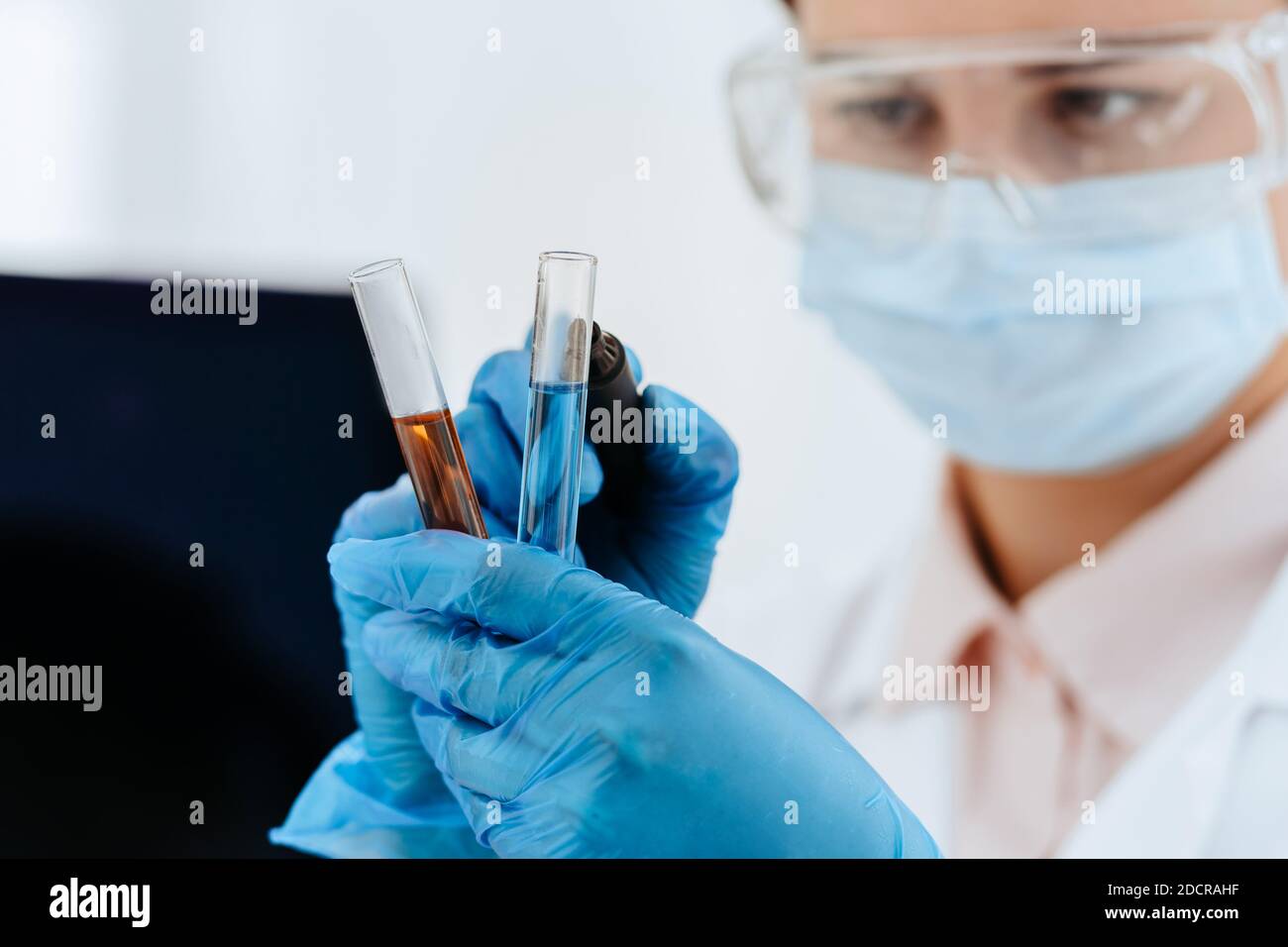 close up. female scientist marks tubes with tests Stock Photo - Alamy