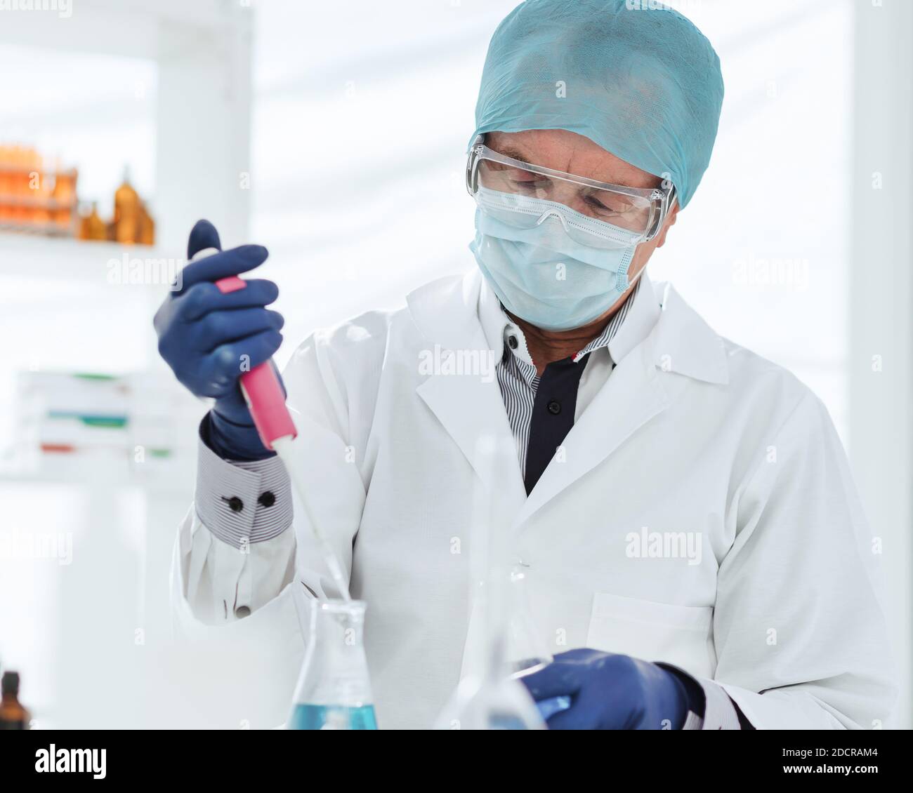 close up. a scientist testing a liquid in a laboratory flask Stock ...