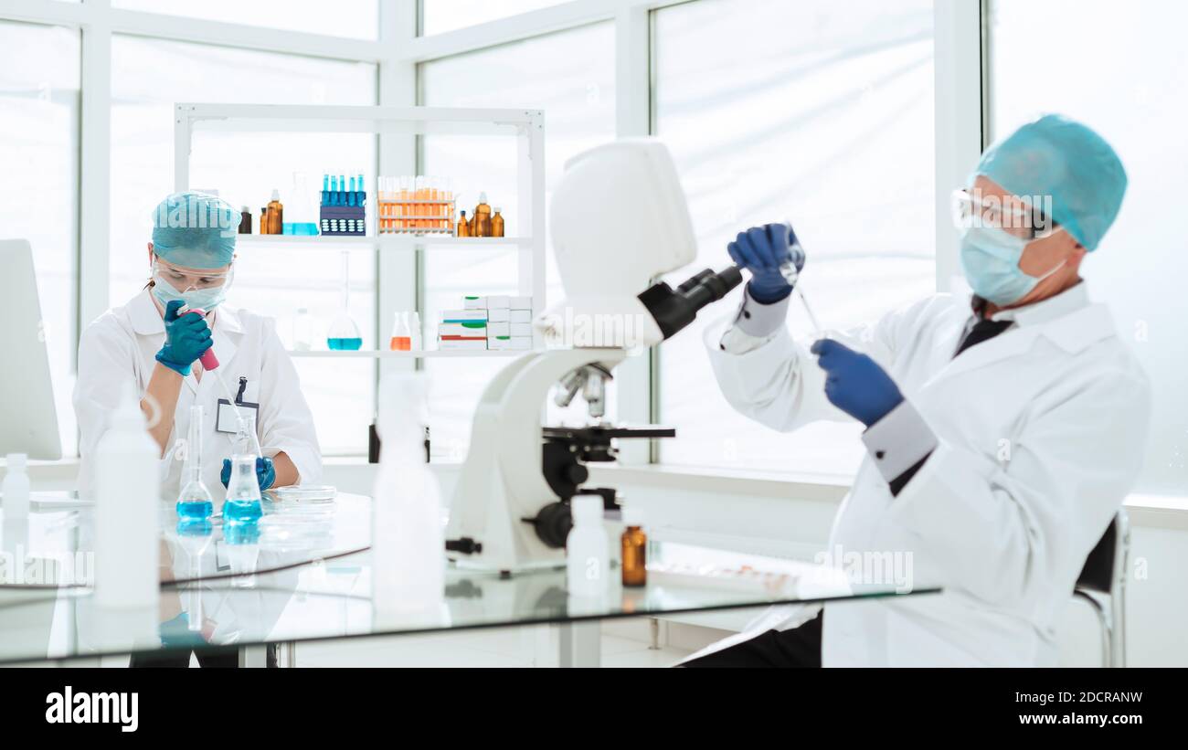 close up. a group of scientists are testing new drugs Stock Photo - Alamy