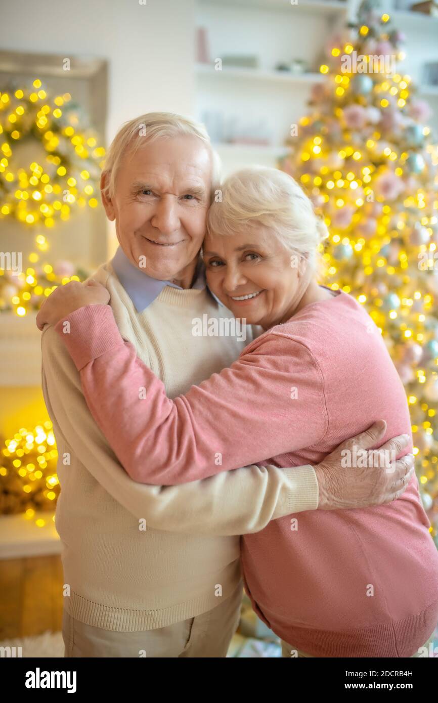 Senior couple hugging each other and feeling happy Stock Photo - Alamy