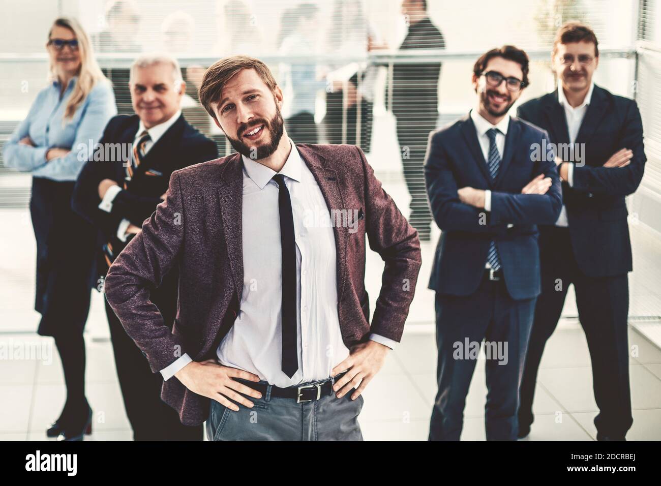 group of leading experts standing in the office Stock Photo - Alamy
