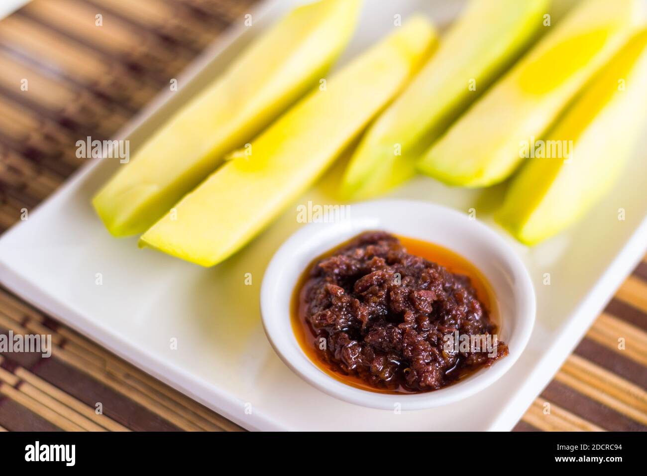 Sliced green mango with bagoong popular in the Philippines Stock Photo ...