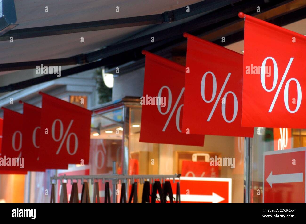 Sale sign in retail, red flags with white percent symbol Stock Photo ...