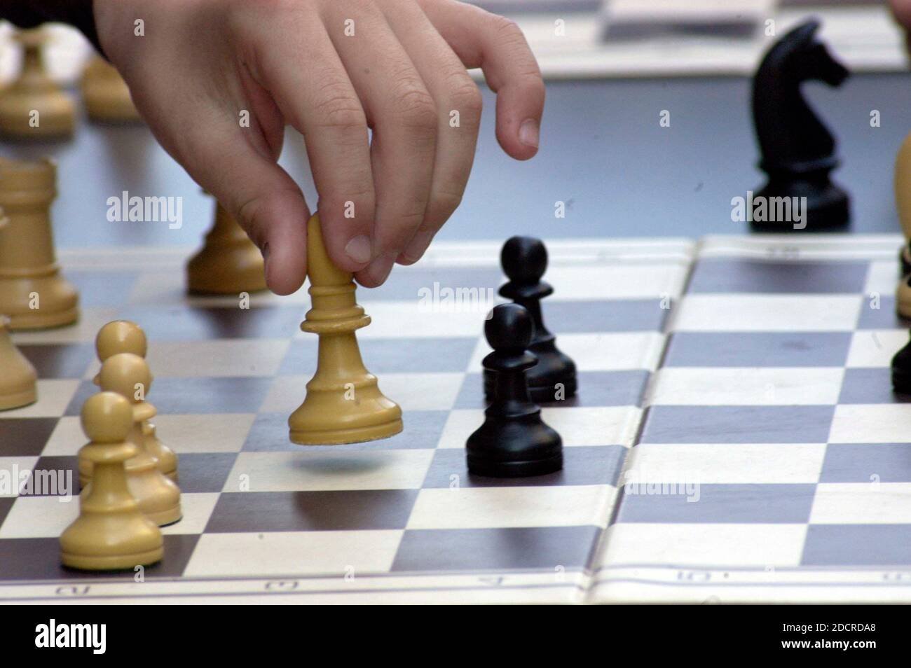 playing a game of chess, hand moving chess figures around Stock Photo ...