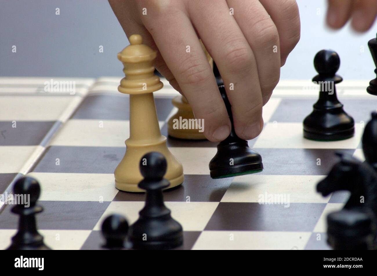 playing a game of chess, hand moving chess figures around Stock Photo ...