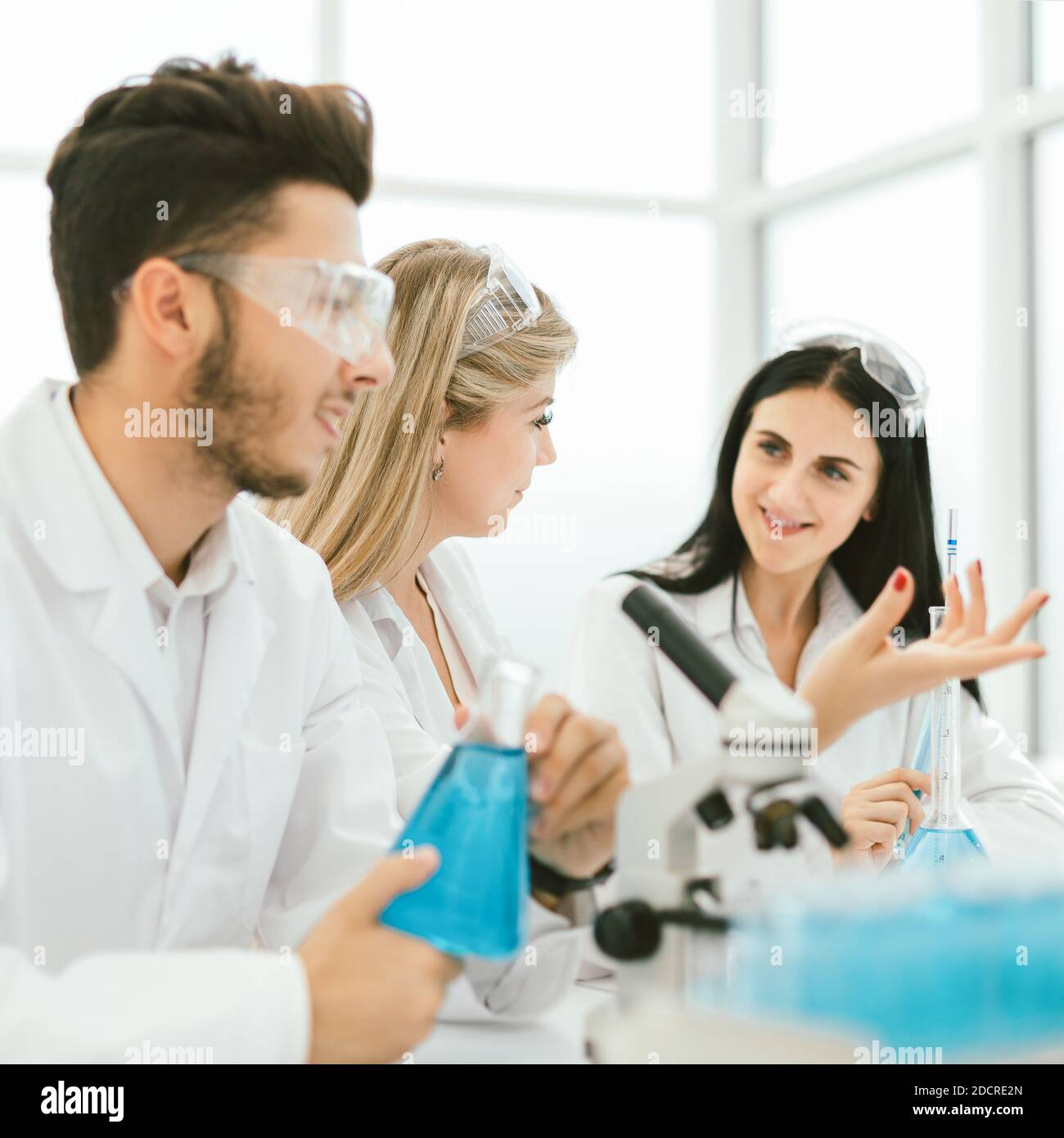 rear view.a group of scientists working in a modern laboratory Stock ...
