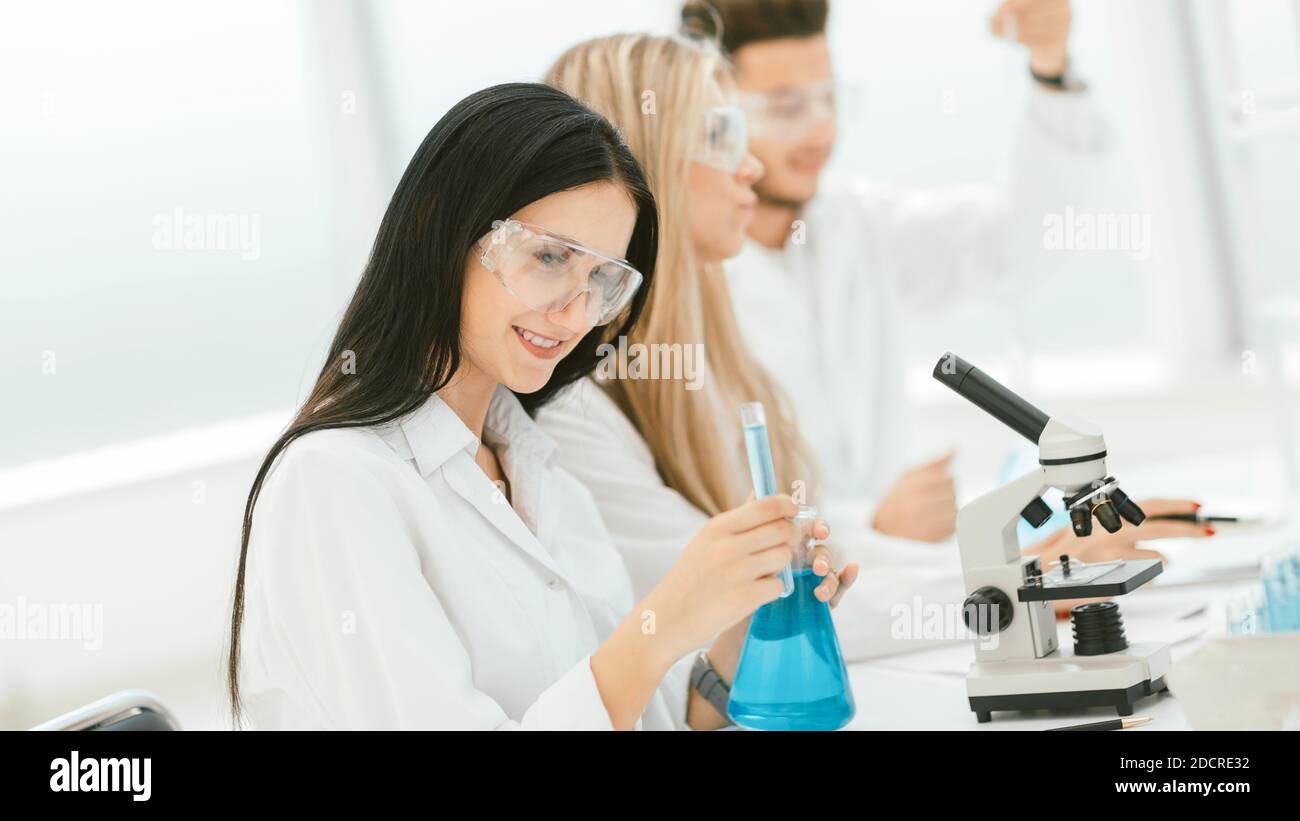 group of young scientists conduct research in the laboratory Stock ...