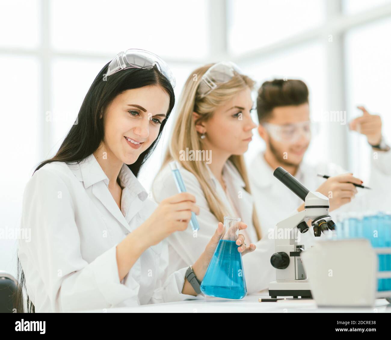 group of young scientists conduct research in the laboratory Stock ...