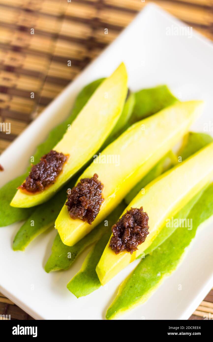 Sliced green mango with bagoong popular in the Philippines Stock Photo ...
