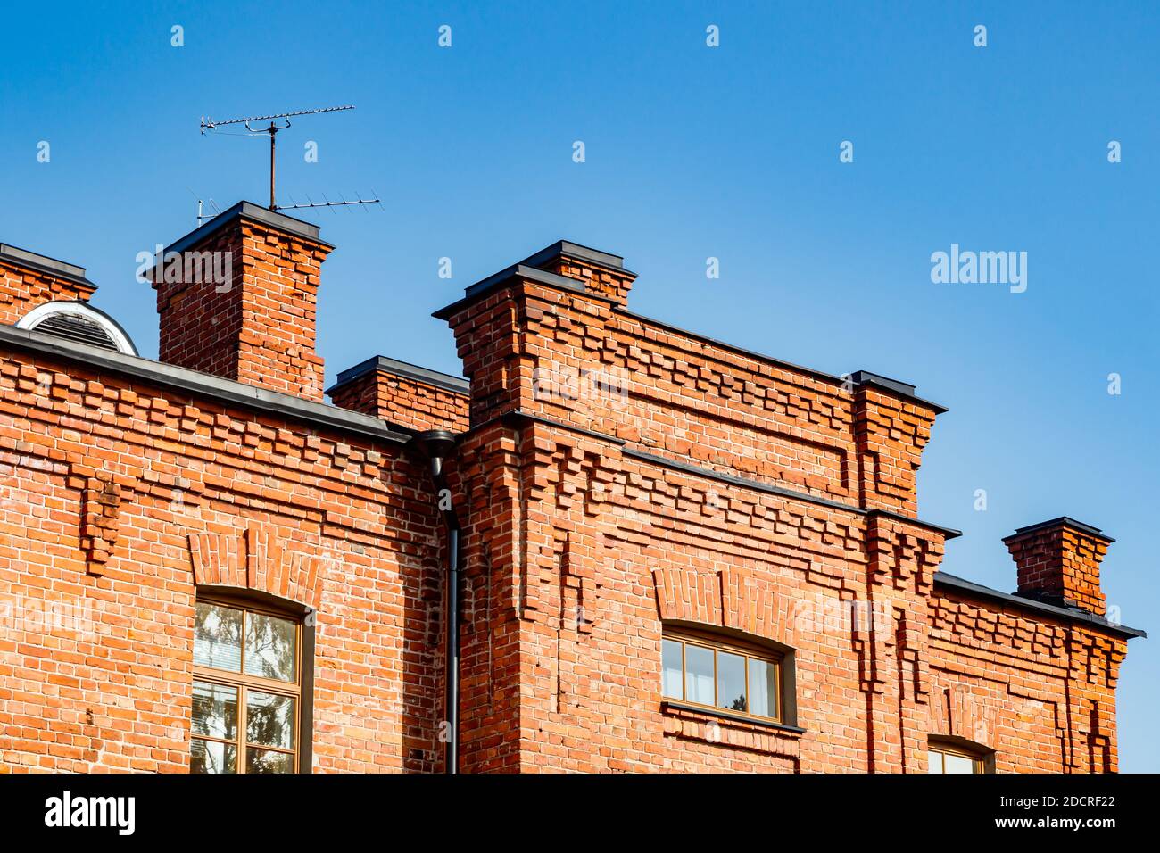 Roof of beautiful vintage red brick building Stock Photo - Alamy
