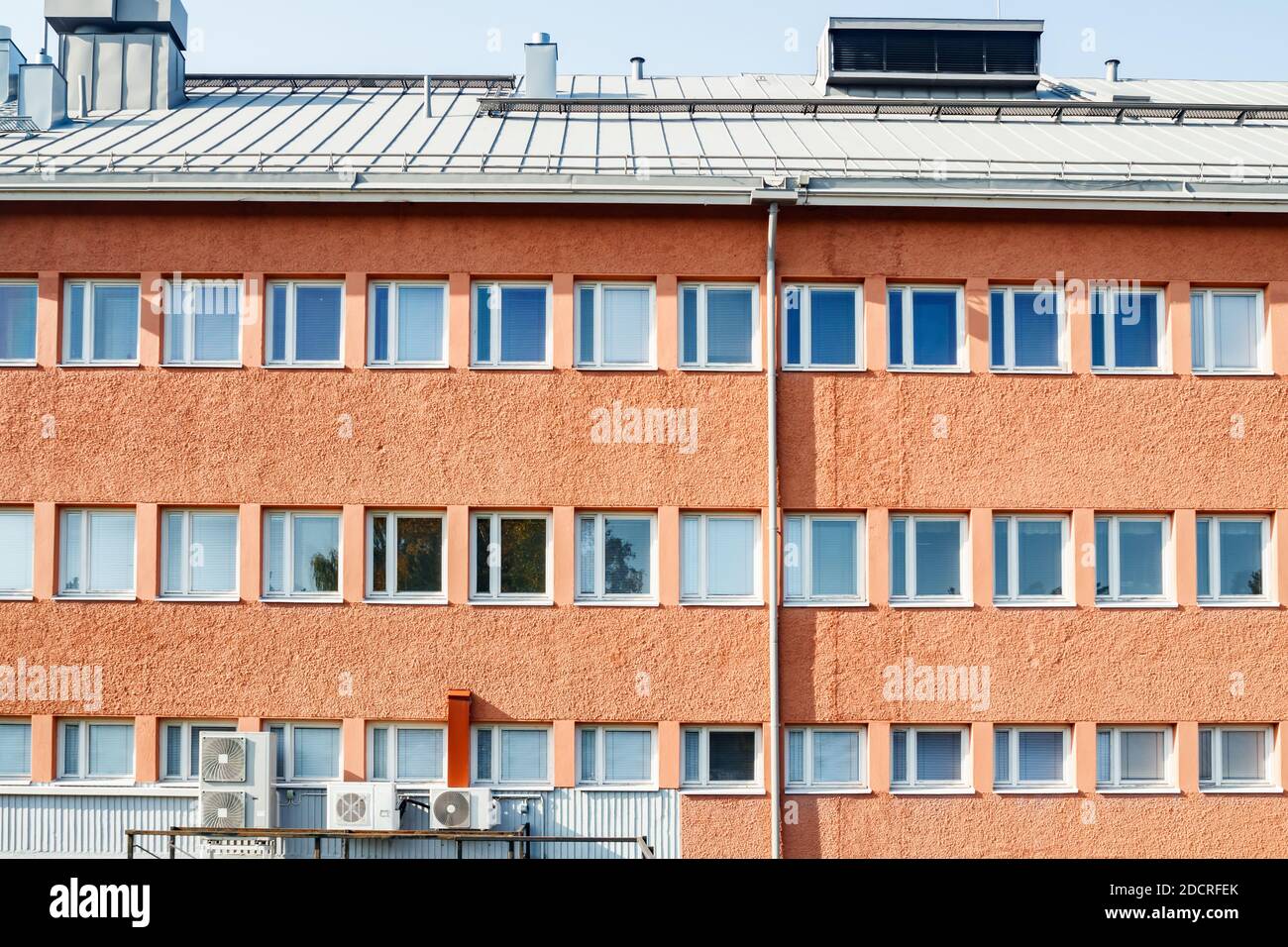 Facade of a building with rows of windows Stock Photo - Alamy