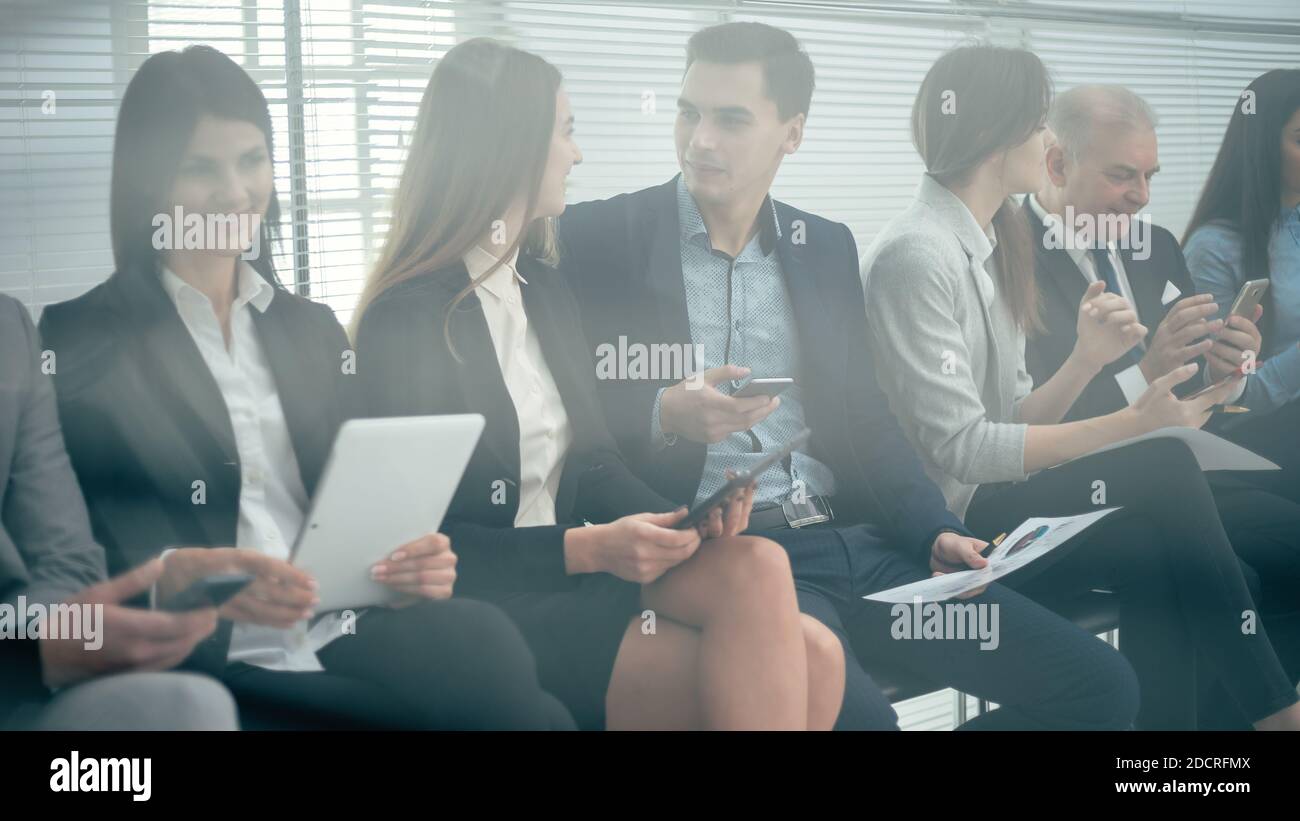 group of candidates filling out an interview form Stock Photo - Alamy