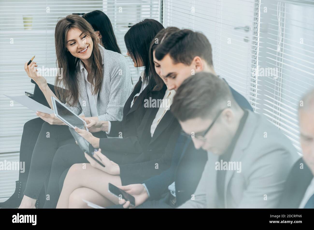 image of a group of candidates waiting for an interview Stock Photo - Alamy