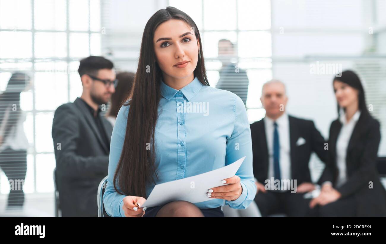 close up. female consultant against the background of a modern office ...