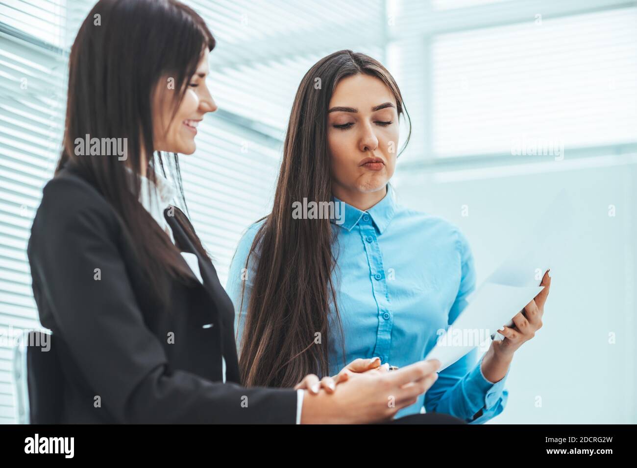 two young employees discussing business documents. photo with copy ...