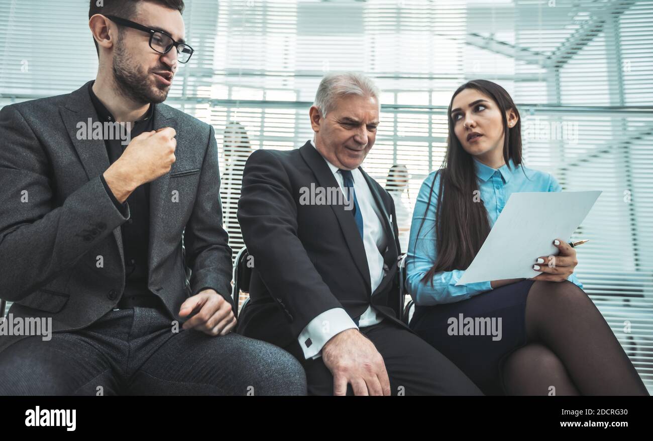 Multiethnic employees discuss business hi-res stock photography and ...