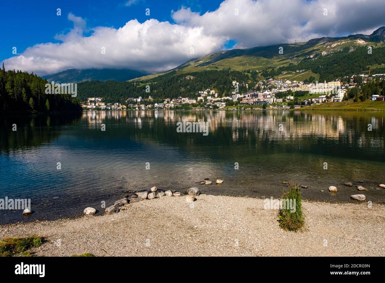 The town of St. Moritz is reflecting in the Lake St. Moritz, the ...