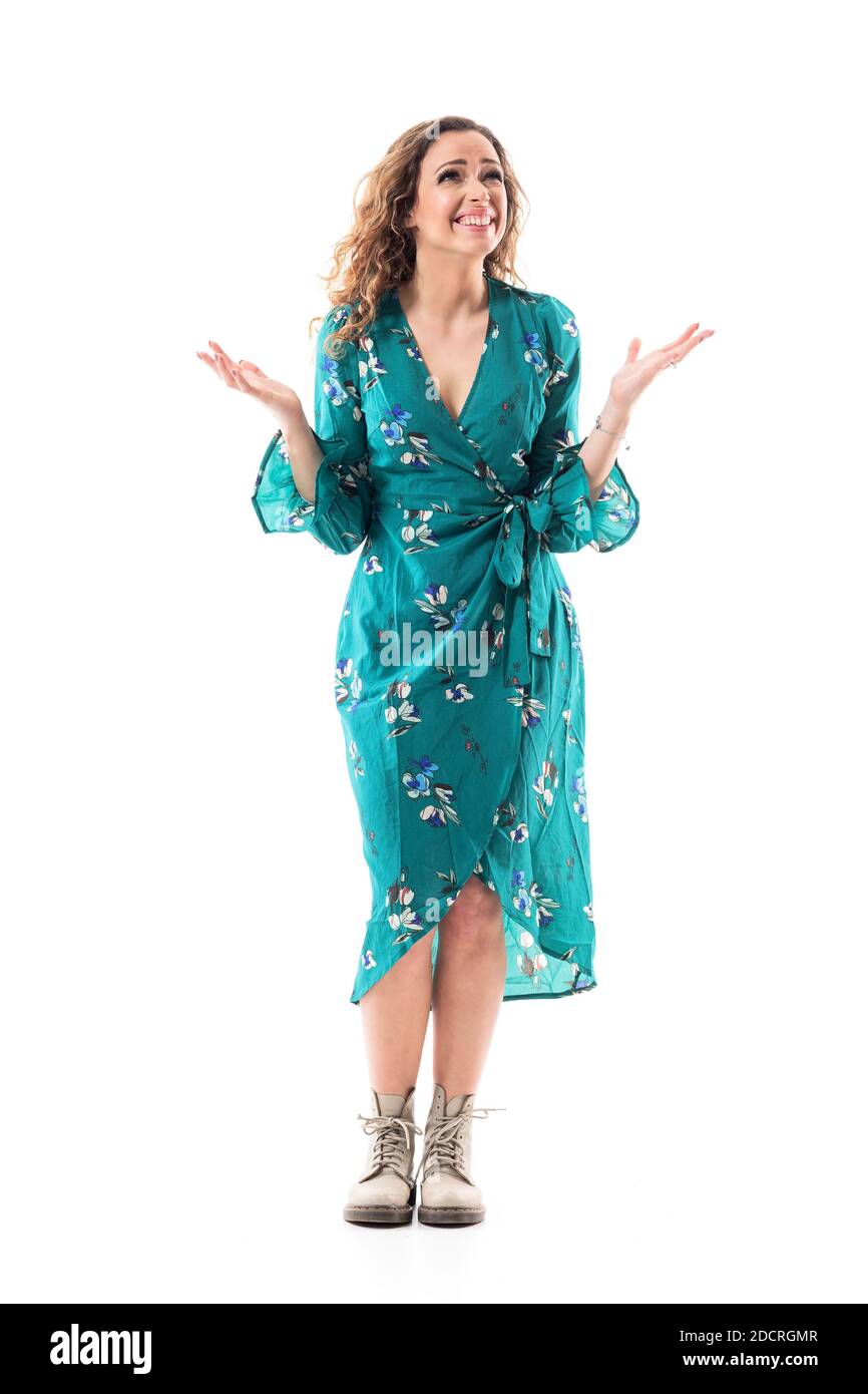 Cheerful enthusiastic young woman with open arms and raised hands ...