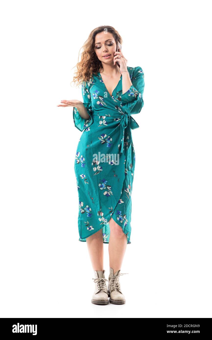 Cute stylish talkative young relaxed woman talking on mobile phone and ...