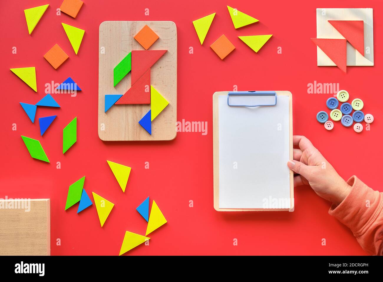 Creative design, Autism World Day, writing pad in hand. Tangram puzzle ...