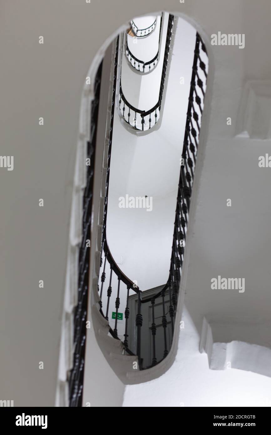 Stairwell from Below: White Oval Shape of Stairs in a Multi-storey ...