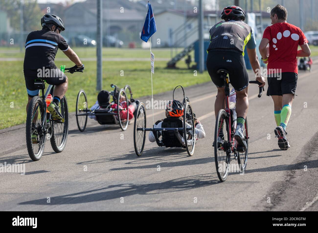 Disabled Athletes training with their Hand Bikes with Cyclist and ...