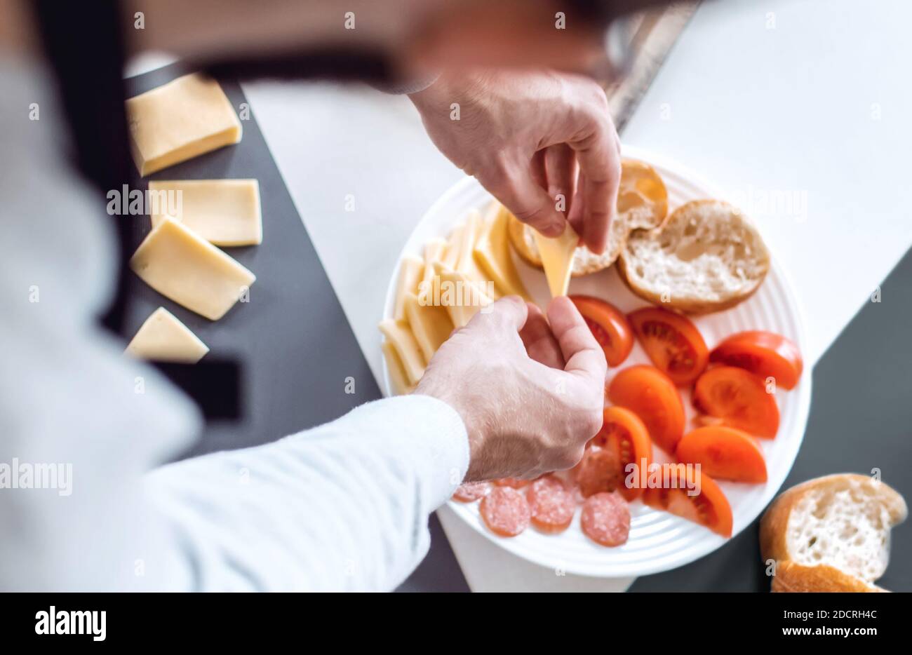 close up. man making sandwiches in the kitchen Stock Photo - Alamy