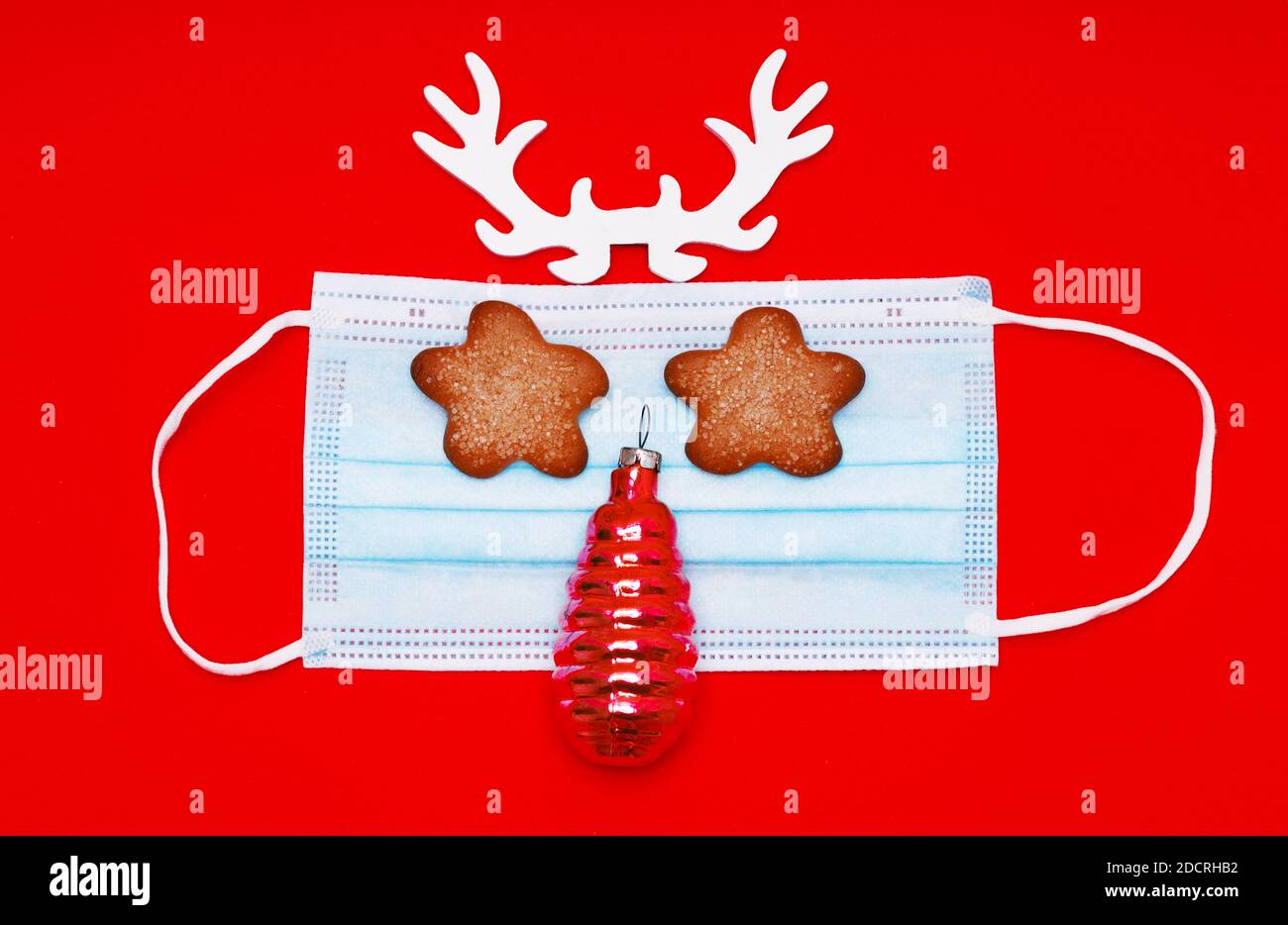 medical mask with deer antlers on a red background. High quality photo ...