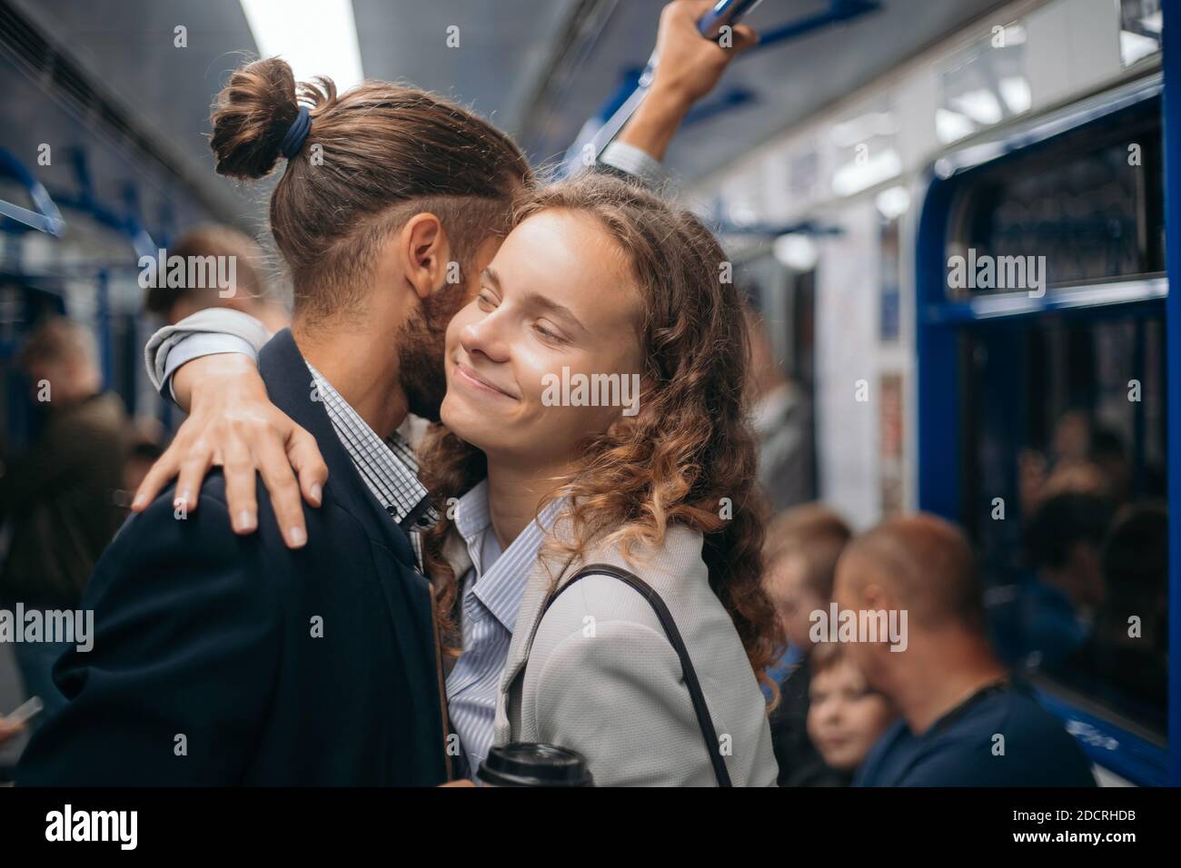 couple in love embraces on a subway train Stock Photo - Alamy