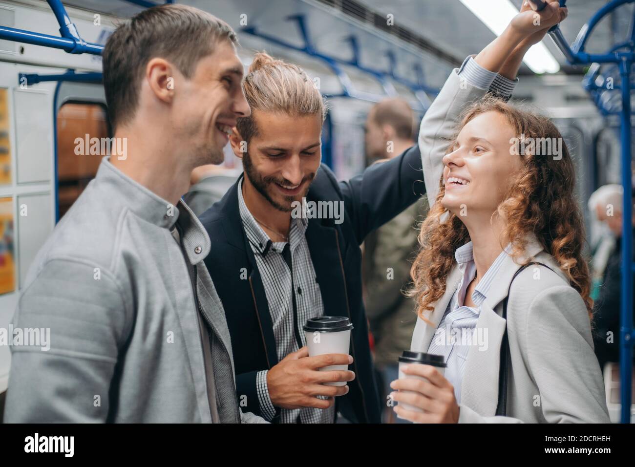 group of students discussing something in the subway car Stock Photo ...