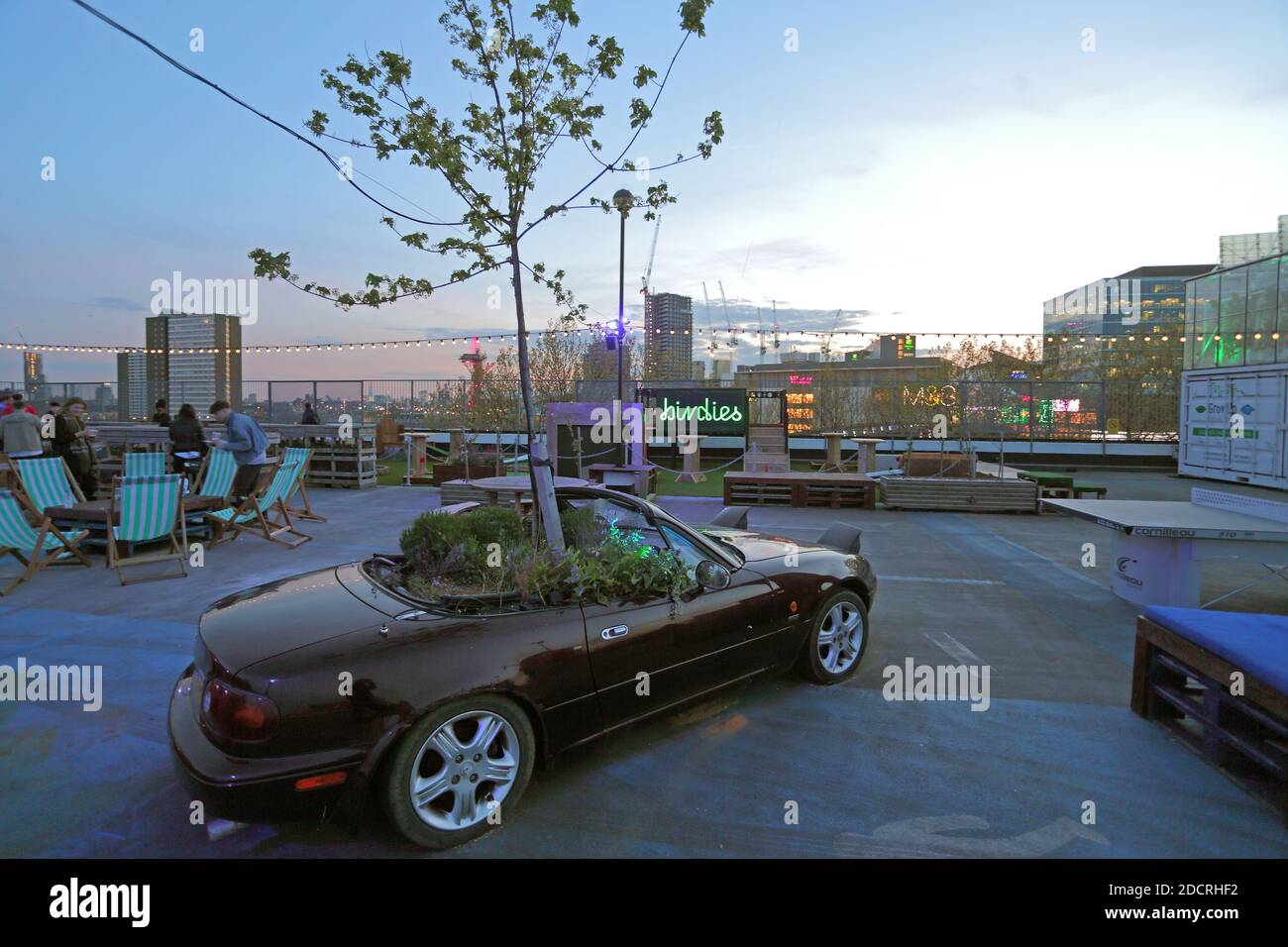 GREAT BRITAIN /London / Car with tree growing out at Great Eastern roof ...