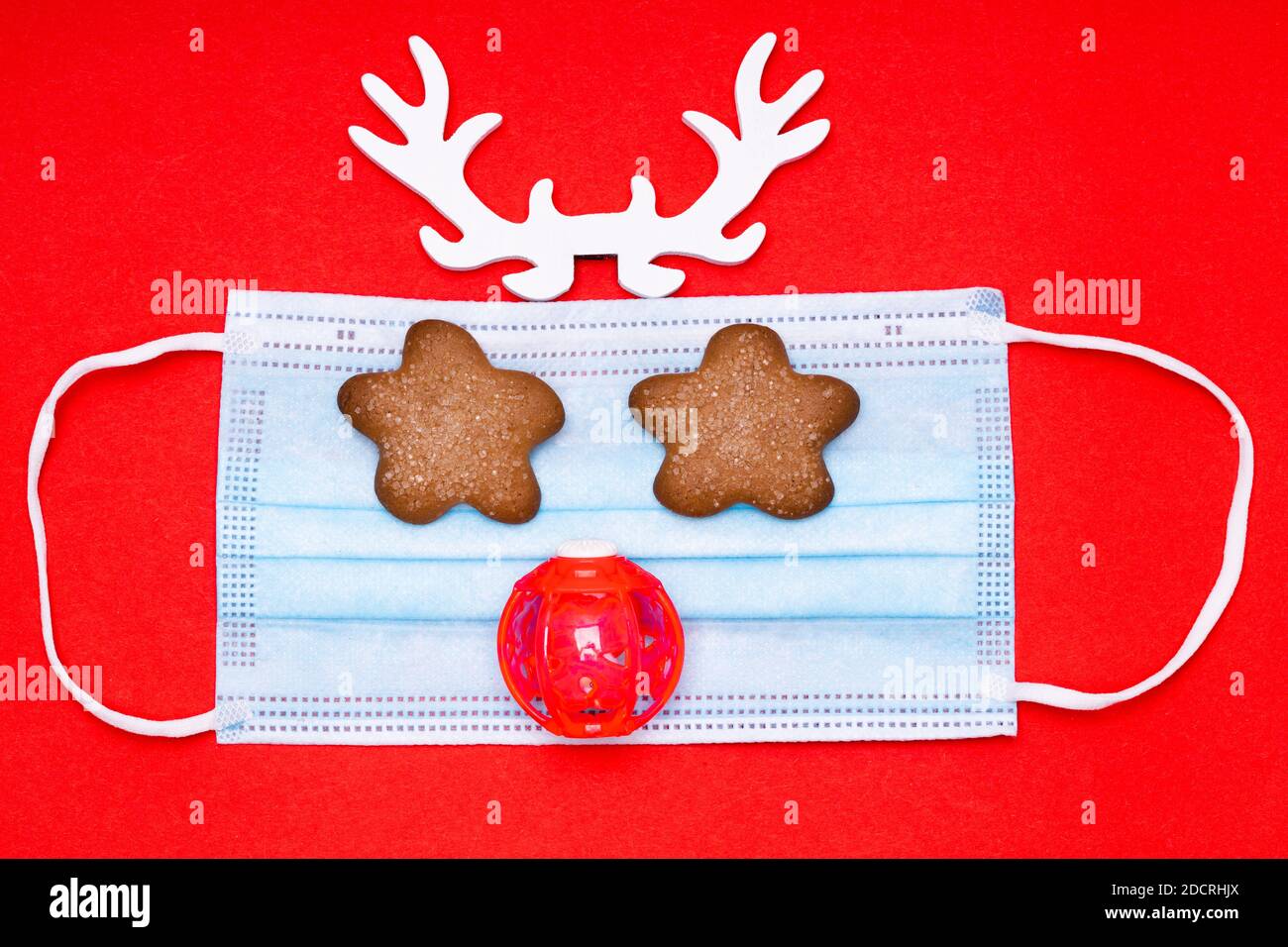 medical mask with deer antlers on a red background. High quality photo ...