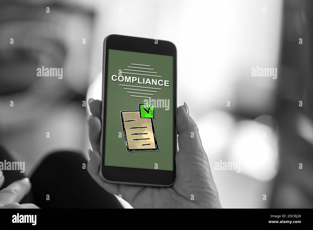 Smartphone screen displaying a compliance concept Stock Photo - Alamy