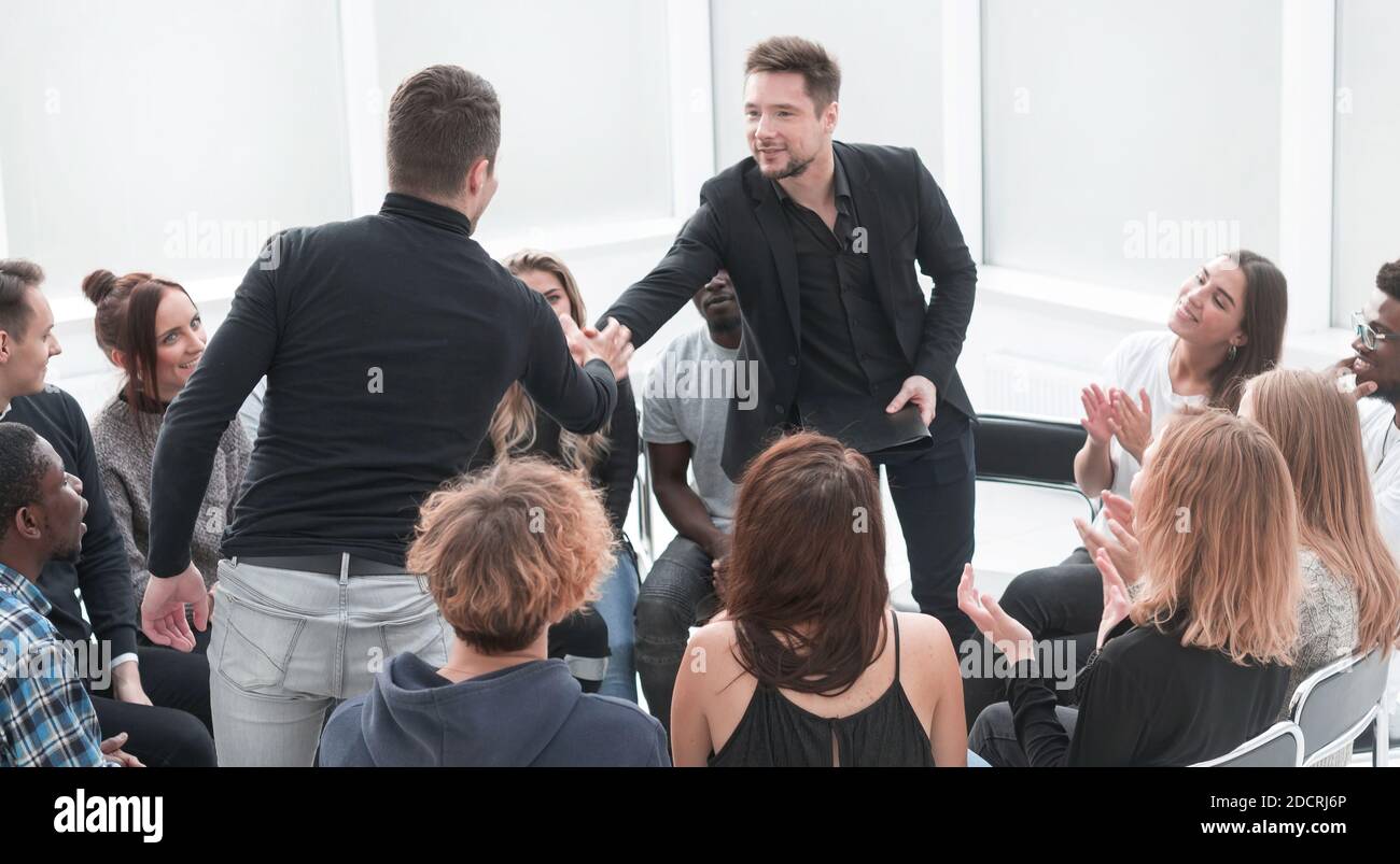 business coach shaking hands with a seminar participant Stock Photo - Alamy