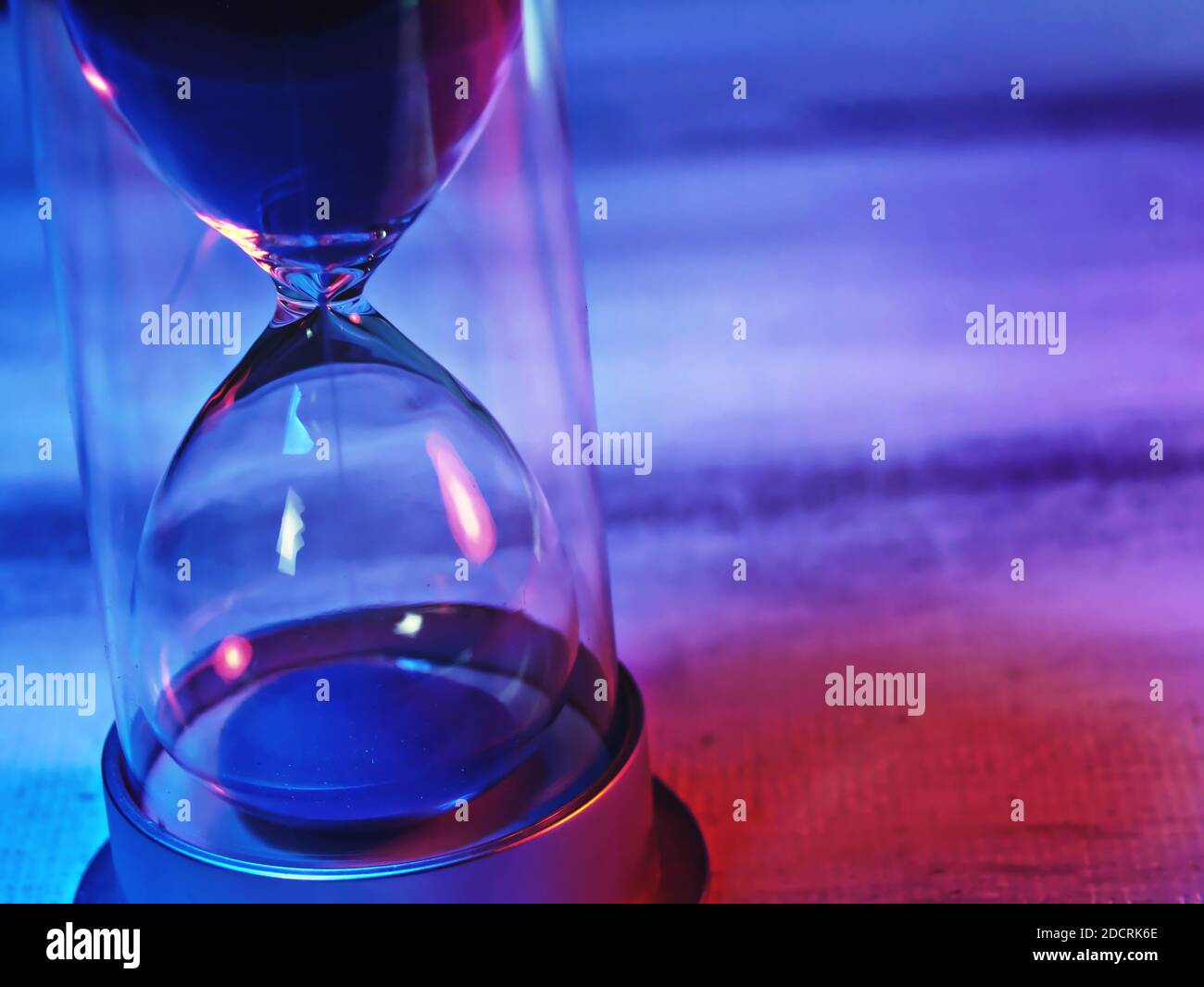 Vintage hour glass in a modern retro style shot. A symbol of time Stock ...