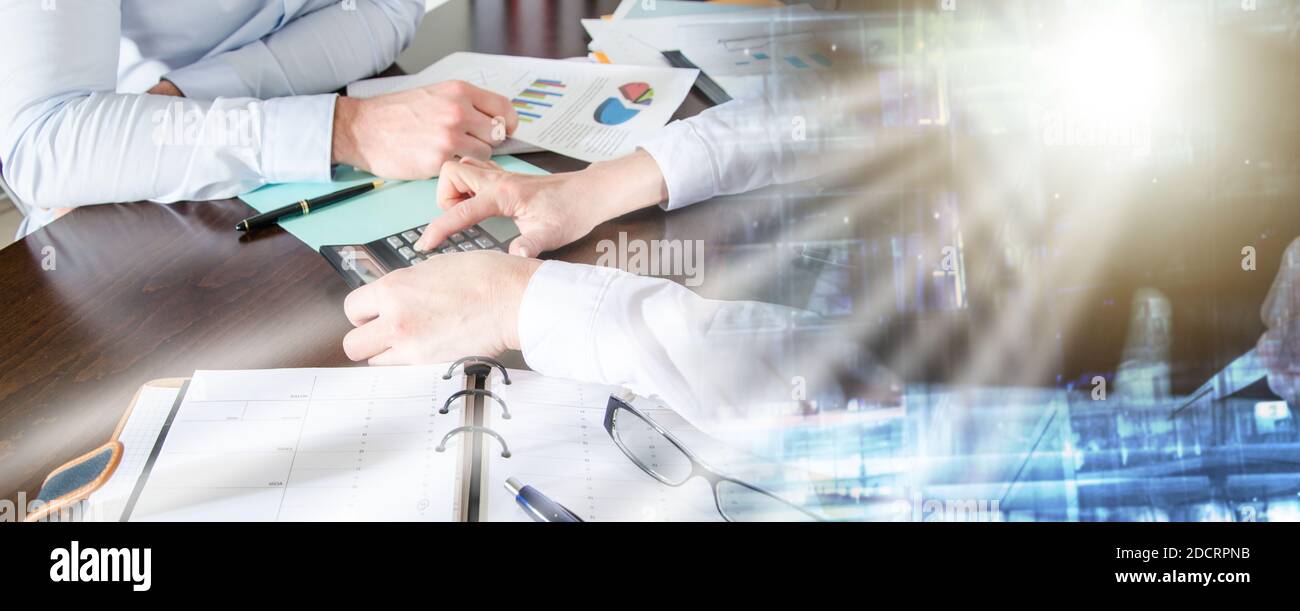 Two business people working together; multiple exposure Stock Photo - Alamy