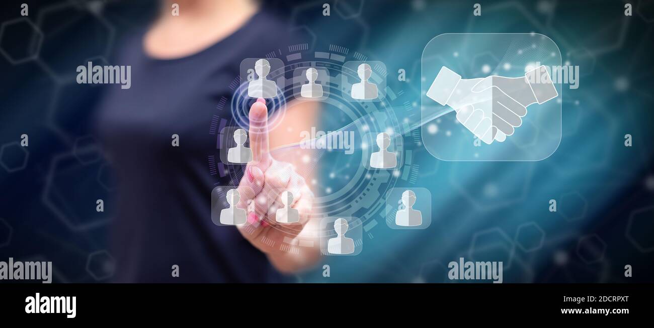 Woman touching a business partner concept on a touch screen with her ...