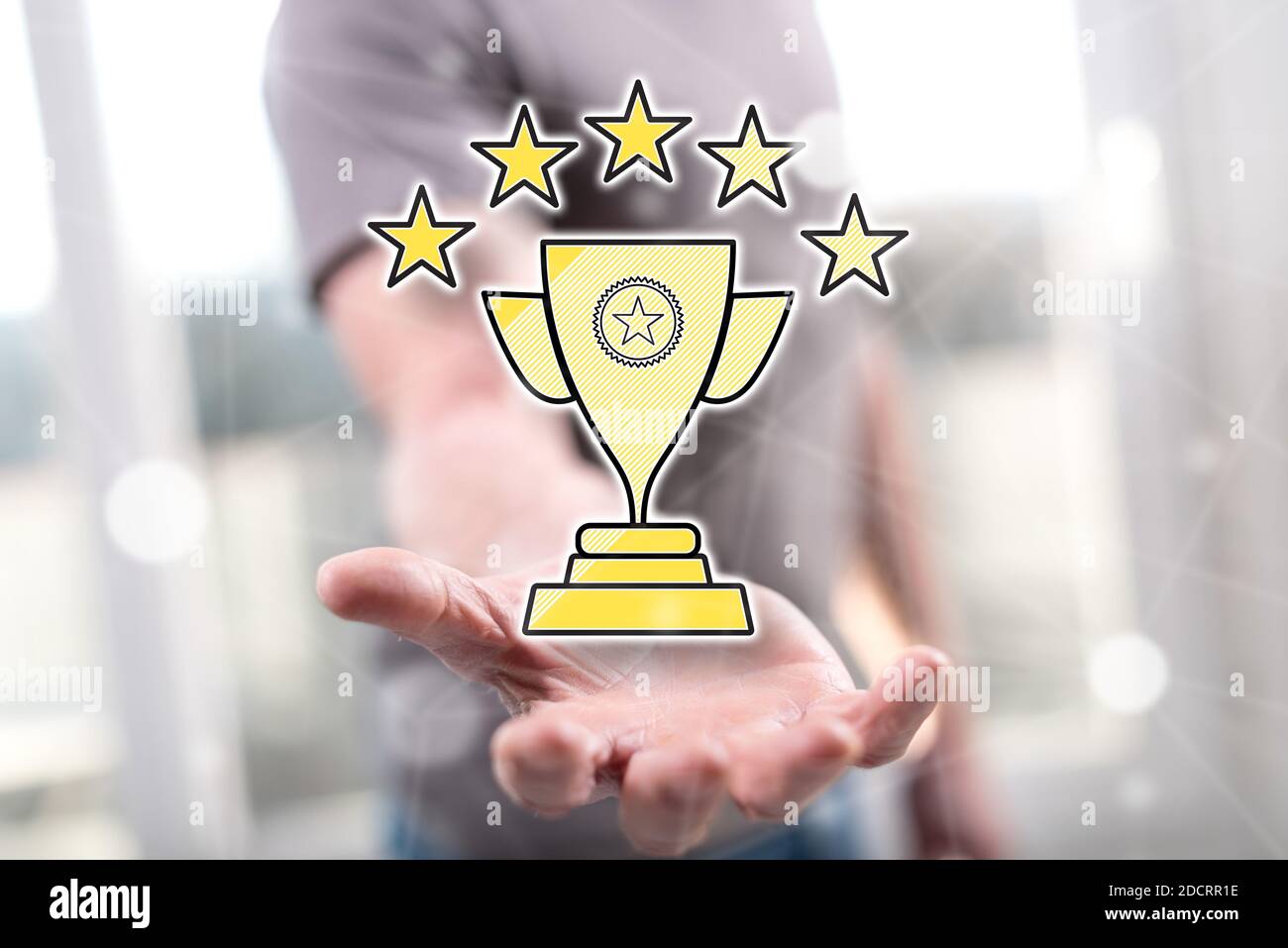 Quality champion concept above the hand of a man in background Stock ...