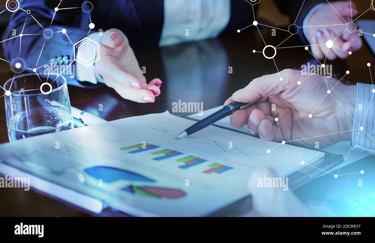 Business people working on a business plan; light effect Stock Photo - Alamy